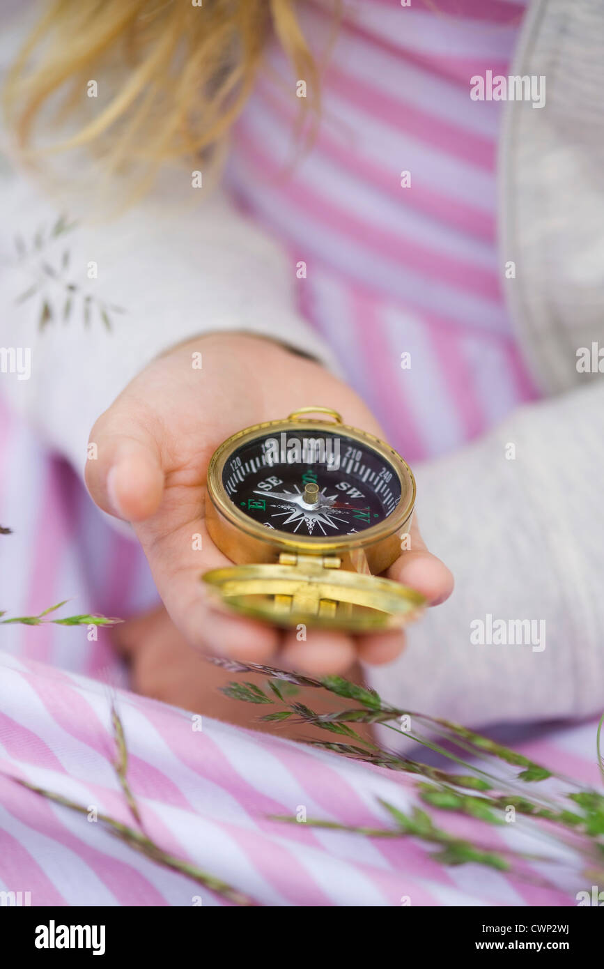 Hands holding compass body hi-res stock photography and images - Alamy
