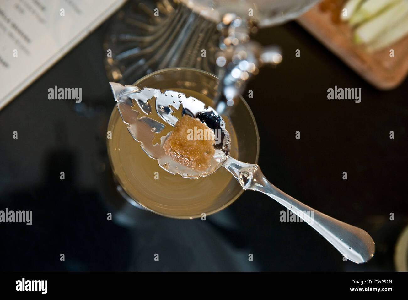 Absinthe shot served the traditional way using a sugar cube Stock Photo ...