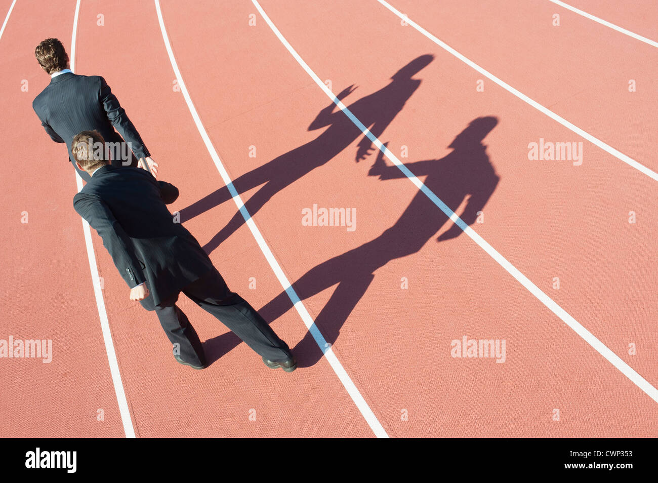 Baton passing shadow hi-res stock photography and images - Alamy