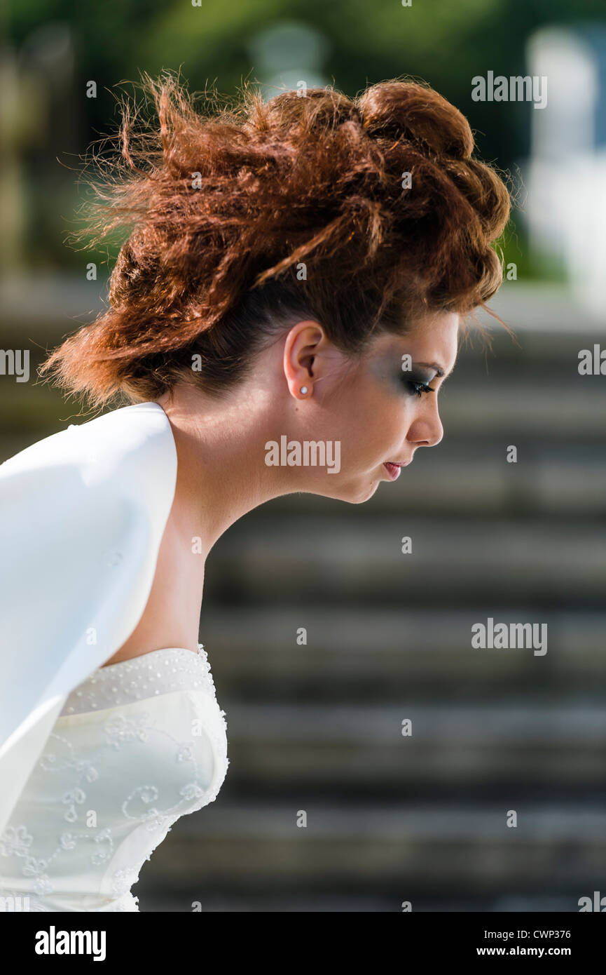 Profile of a young attractive woman in an Alt alternative bride fashion ...