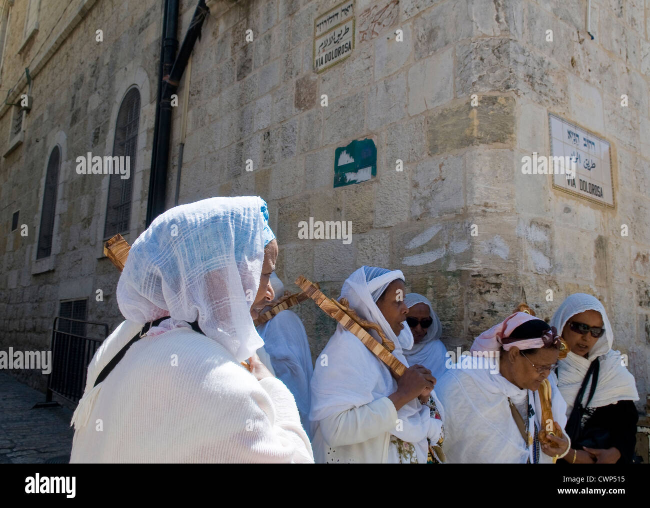 Ethiopian Christian pilgrims carry across along the Via Dolorosa in ...