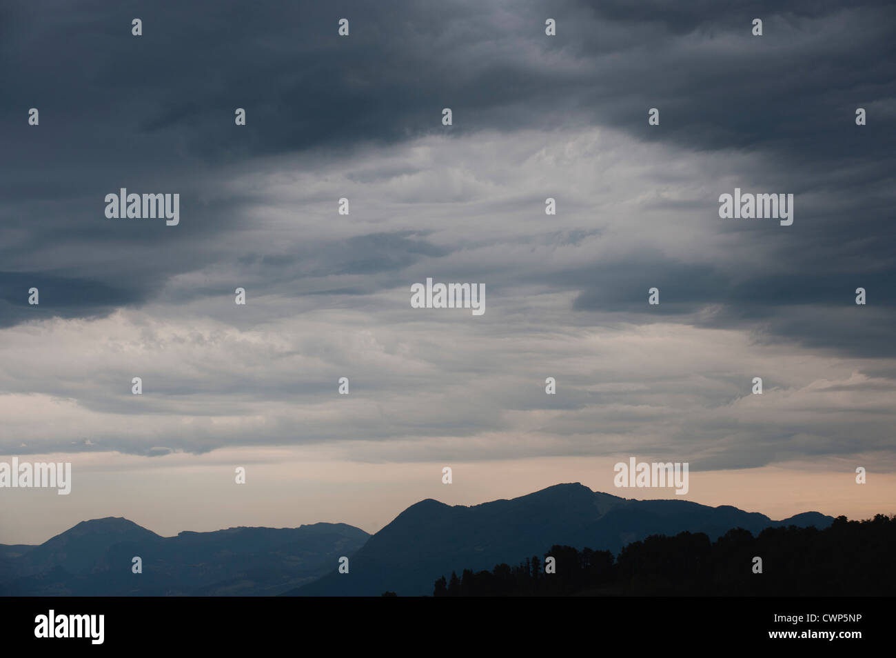 Storm clouds over mountain landscape Stock Photo - Alamy