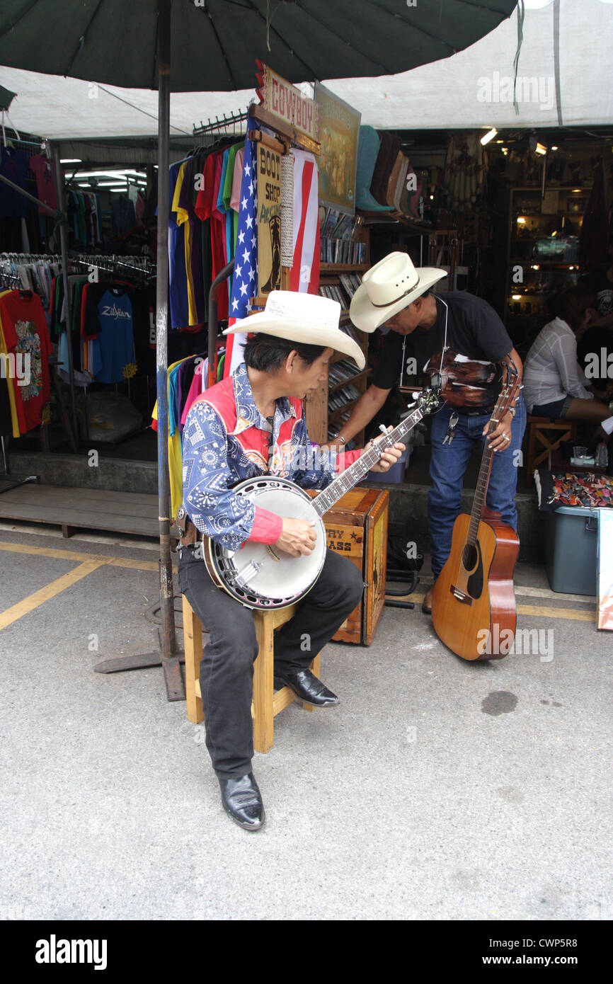 Cowboy musicians performing at Chatuchak Weekend Market in Bangkok ...
