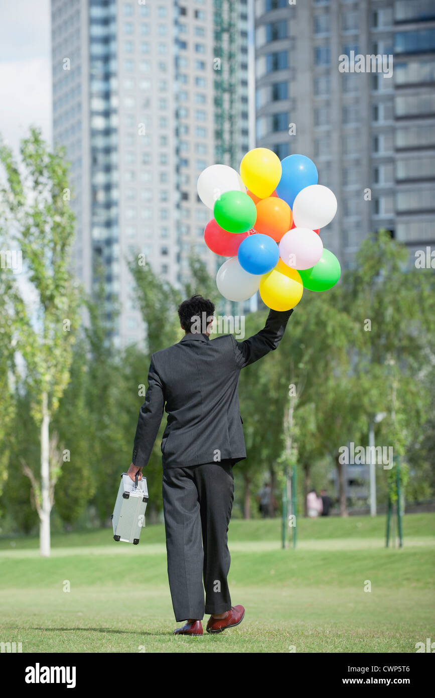 Man carrying balloon hi-res stock photography and images - Alamy