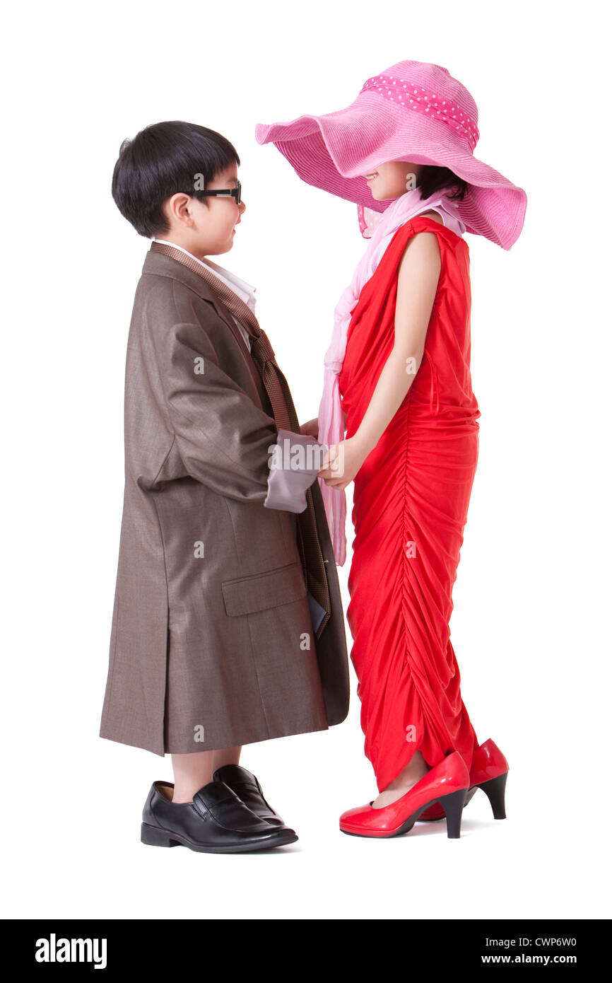 Boy and girl dressing up like adults Stock Photo - Alamy