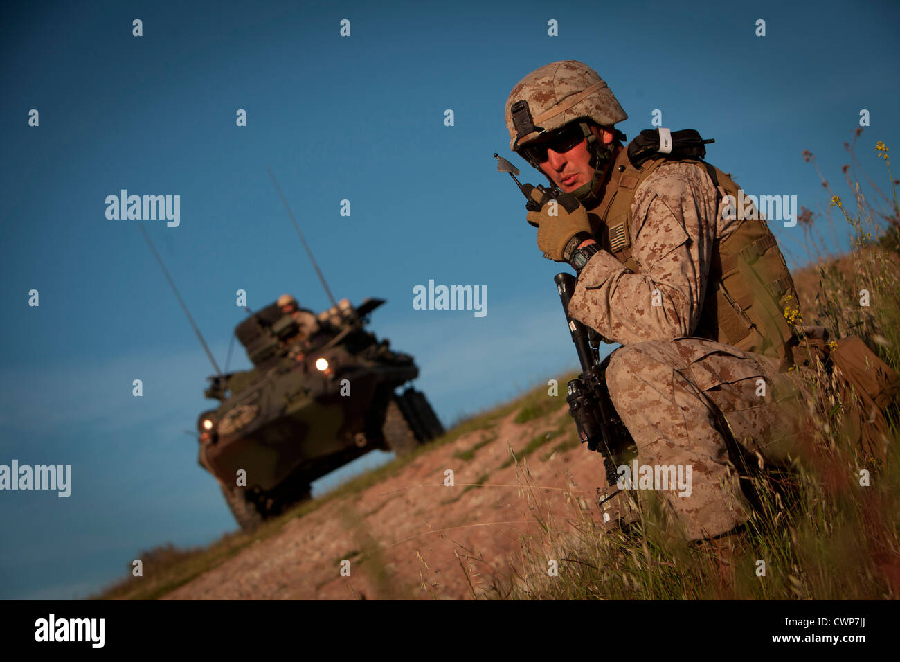 A US Marine relays a status update to his platoon commander during a ...