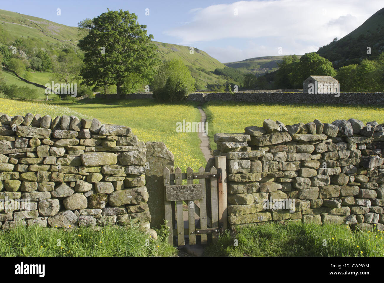 Wooden gate in drystone wall, with 'Winter Food For Stock, Please Keep ...
