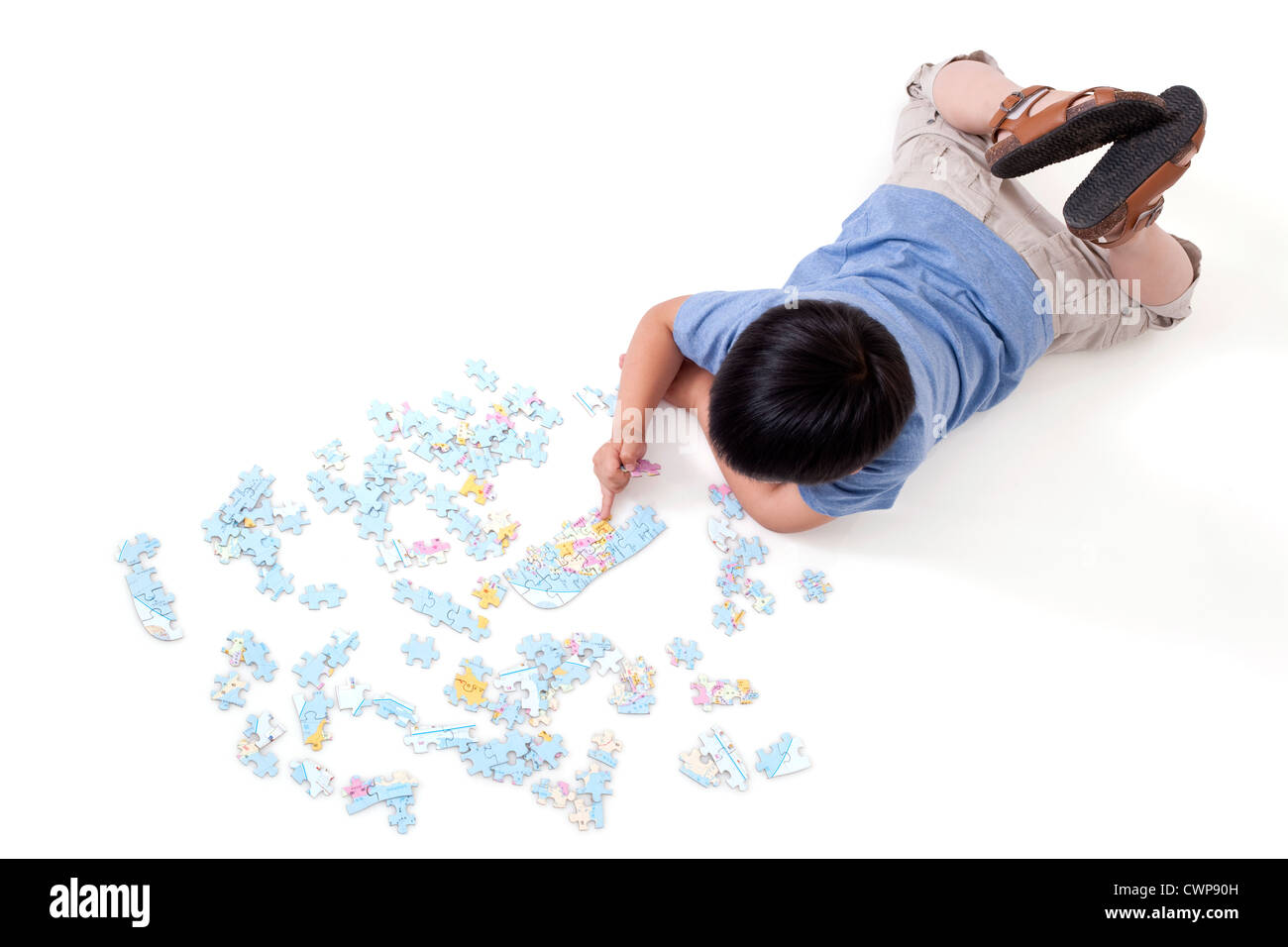 Boy playing jigsaw puzzles Stock Photo - Alamy