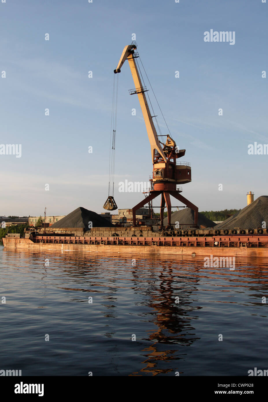Port bulk crane and barge Stock Photo - Alamy