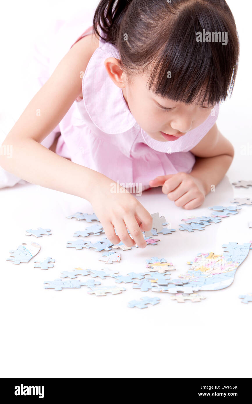 Girl playing jigsaw puzzles Stock Photo - Alamy