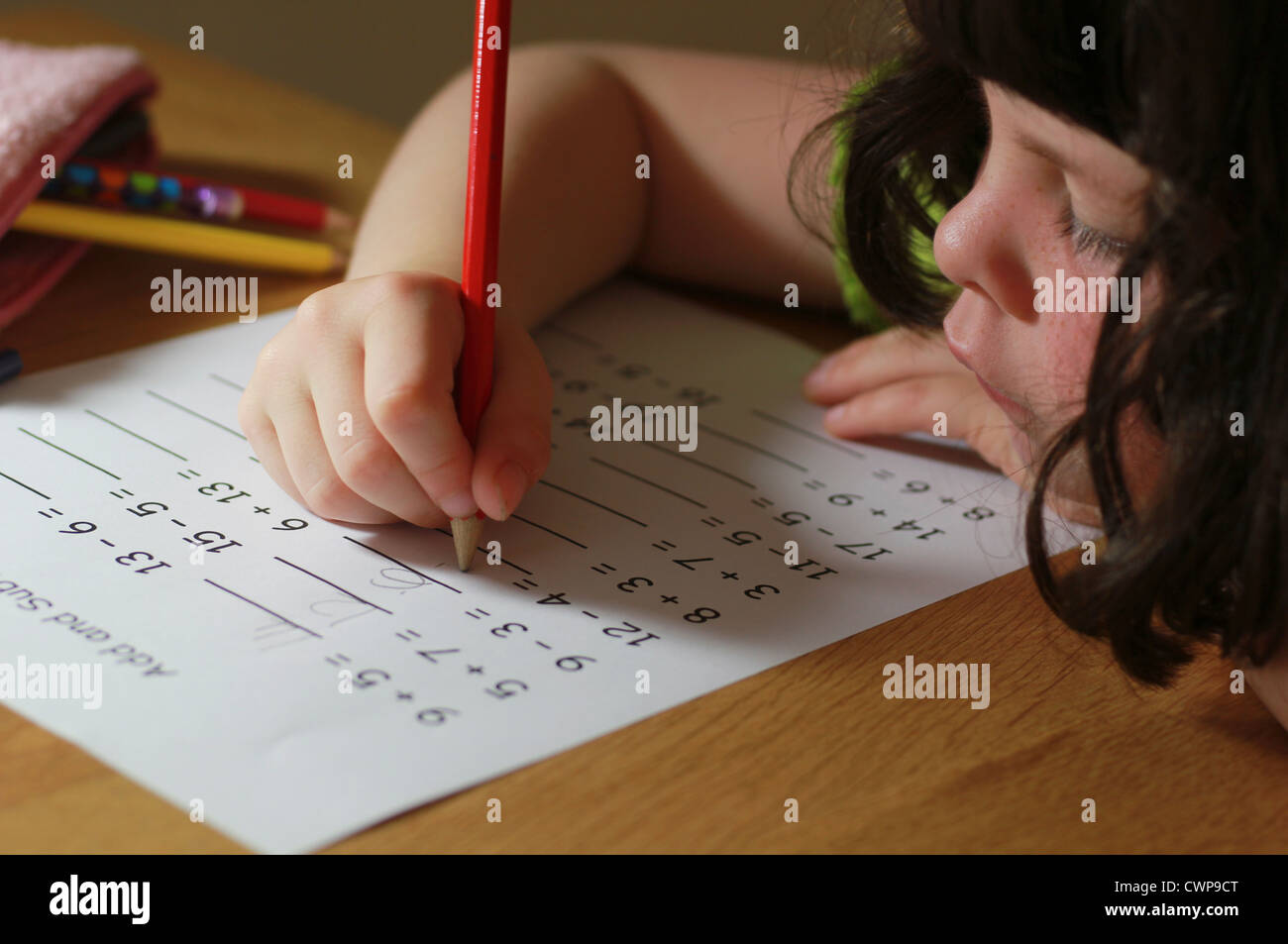 Little girl doing maths homework Stock Photo - Alamy