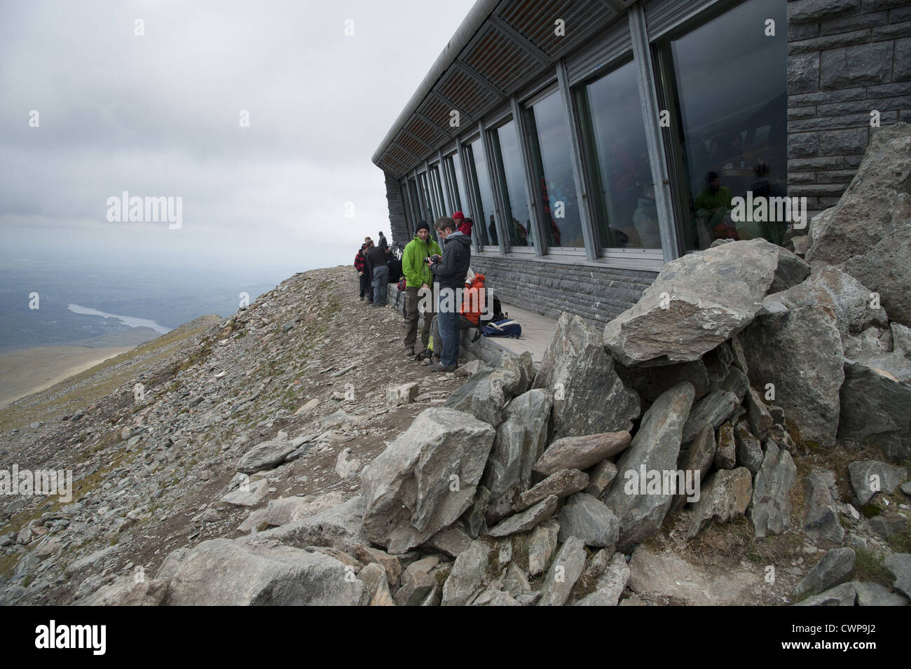 Hafod Eryri visitor centre and walkers on mountain summit, Snowdon ...
