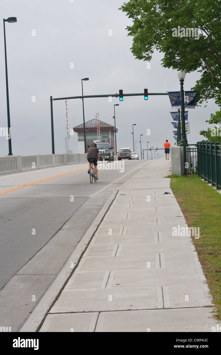 biker and walker cross the Trent River Bridge in New Bern North ...