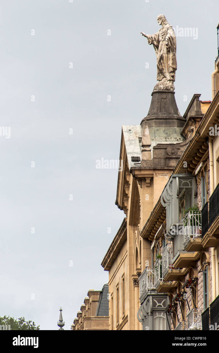 Sculpture at top of building facade. San Sebastian. Historic centre ...