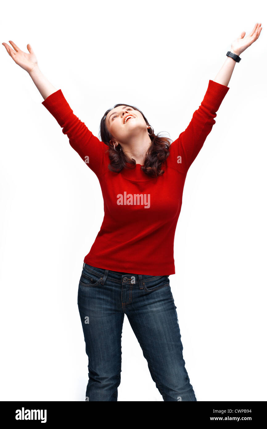 Portrait of a young beautiful girl with her hands raised isolated on ...
