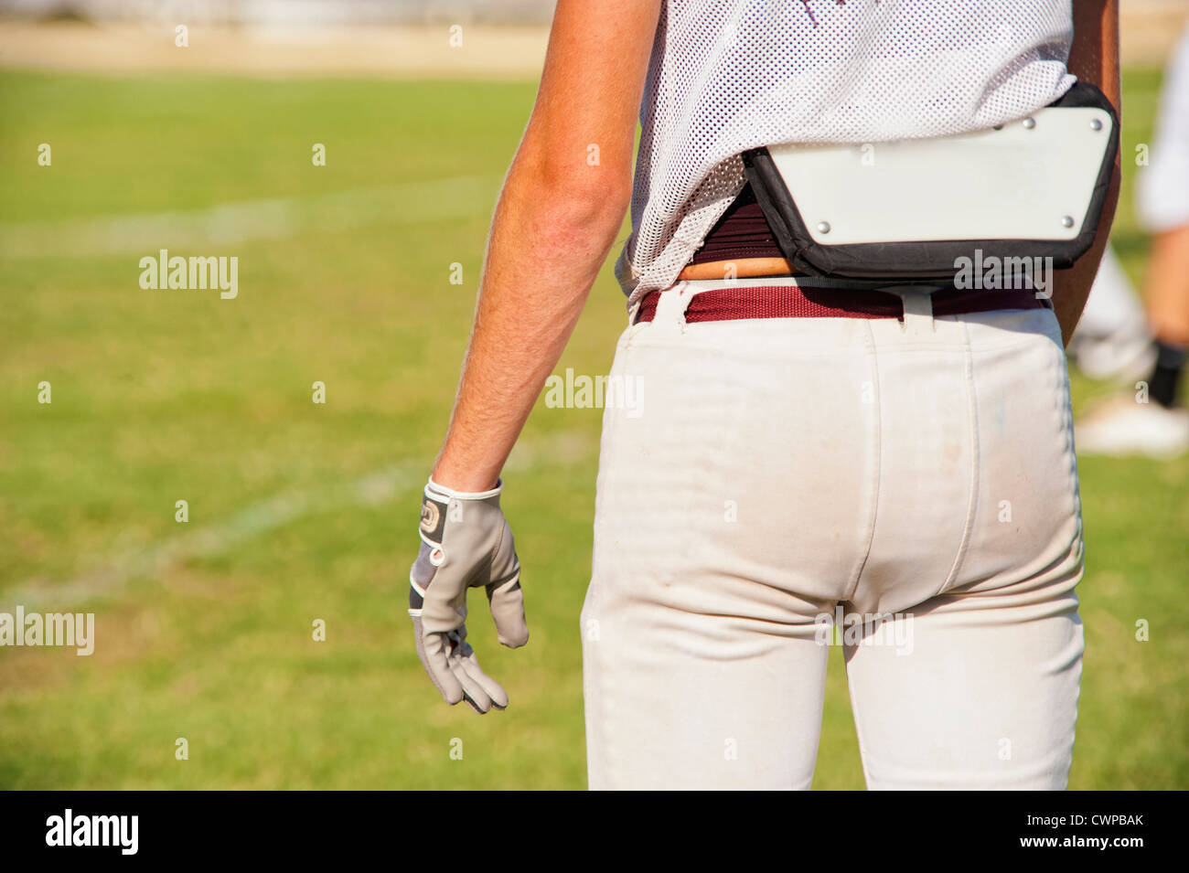 Back side middle section of young American football player Stock Photo ...