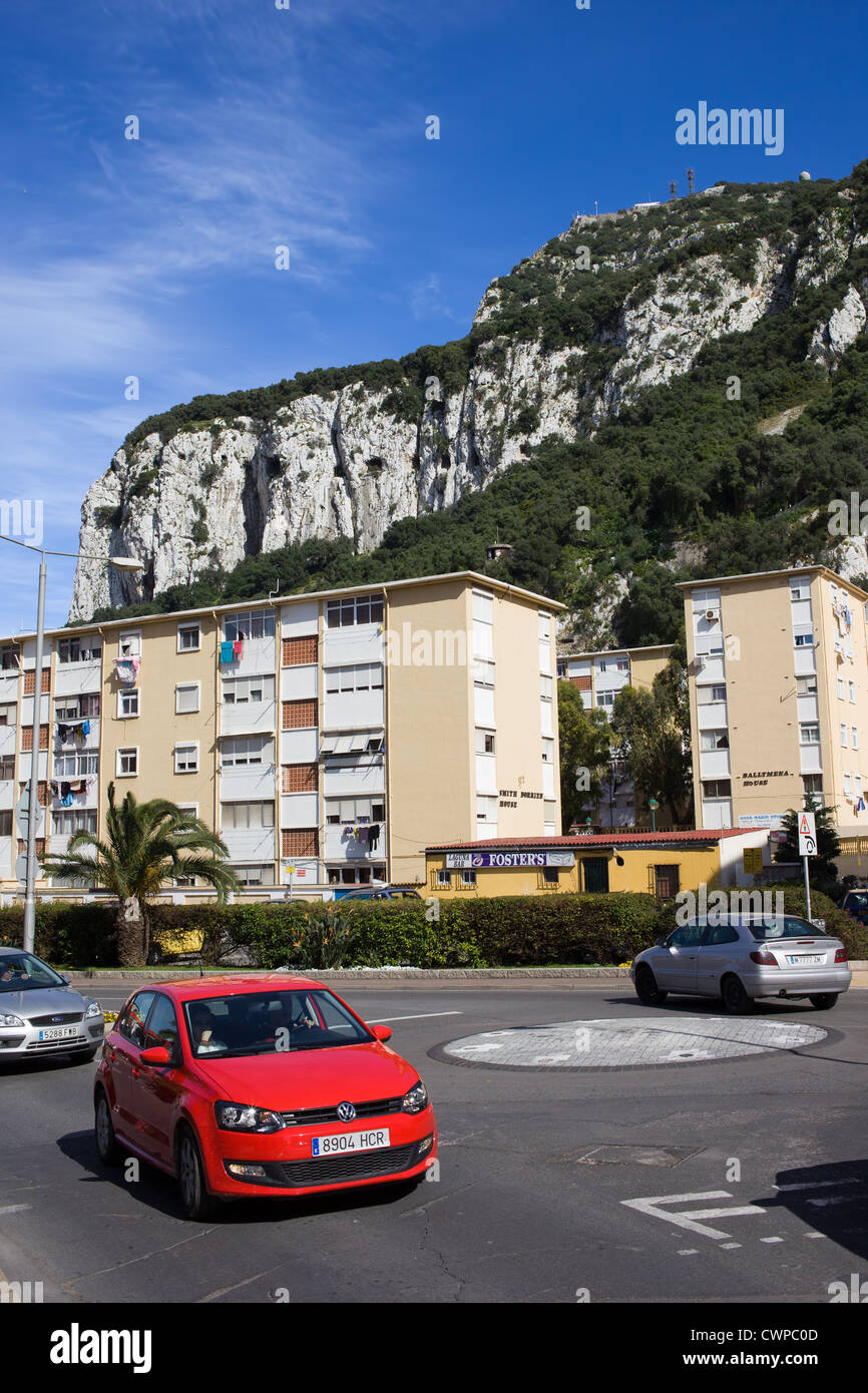 Gibraltar rock urban scenery, cars on roundabout and apartment ...