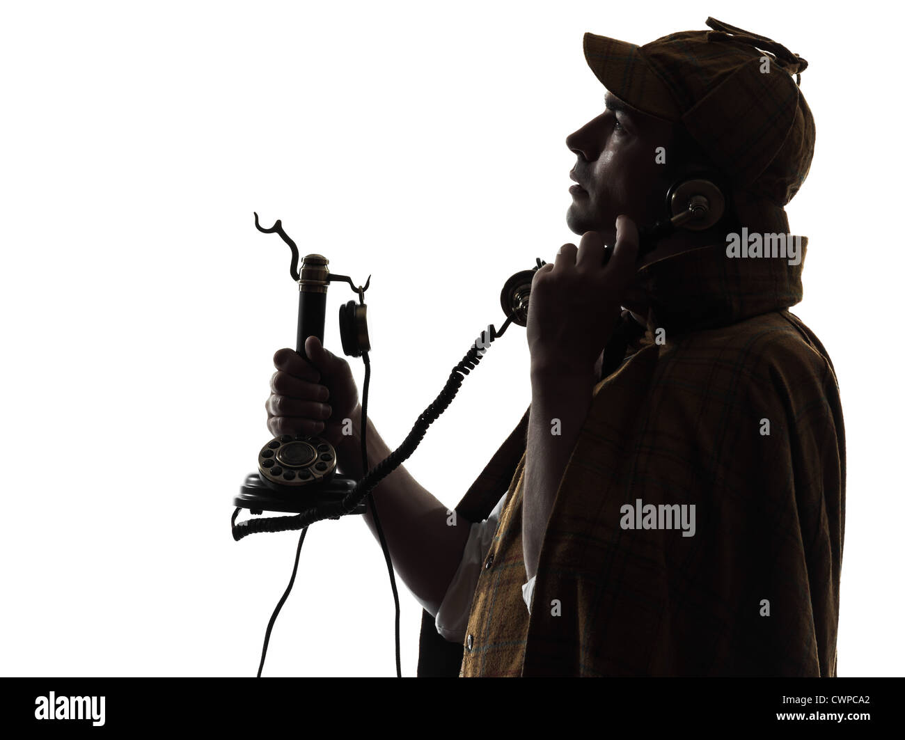 sherlock holmes silhouette on the phone in studio on white background ...