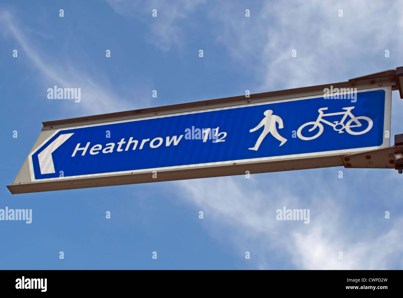 left pointing cycle and walking sign also showing distance to heathrow ...
