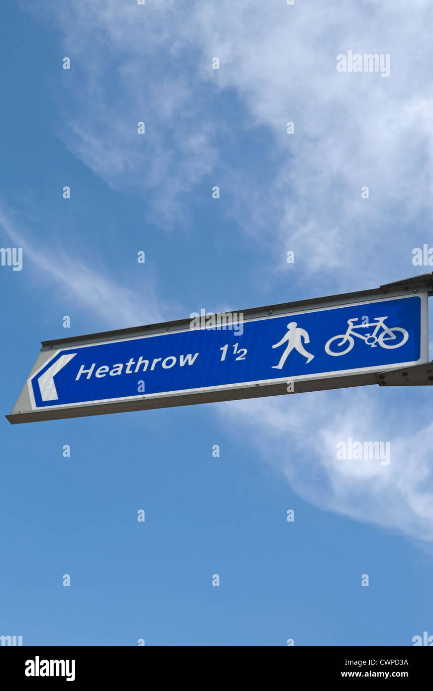 left pointing cycle and walking sign also showing distance to heathrow ...