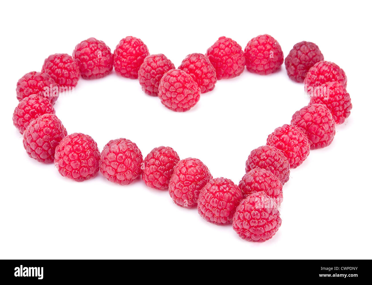 Raspberry shape as heart on white Stock Photo - Alamy