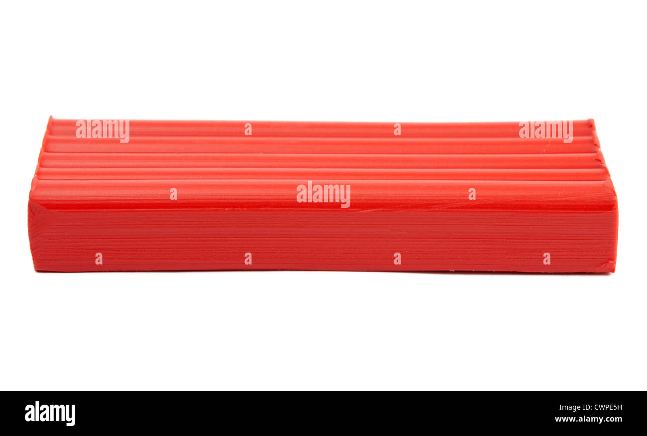 red plasticine isolated is on a white background Stock Photo - Alamy