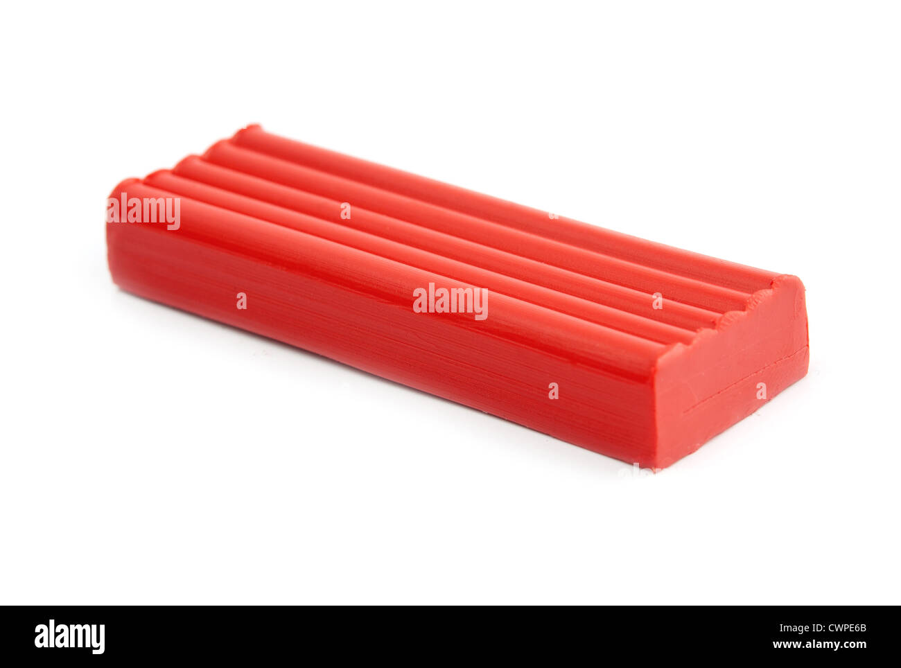 red plasticine isolated is on a white background Stock Photo - Alamy
