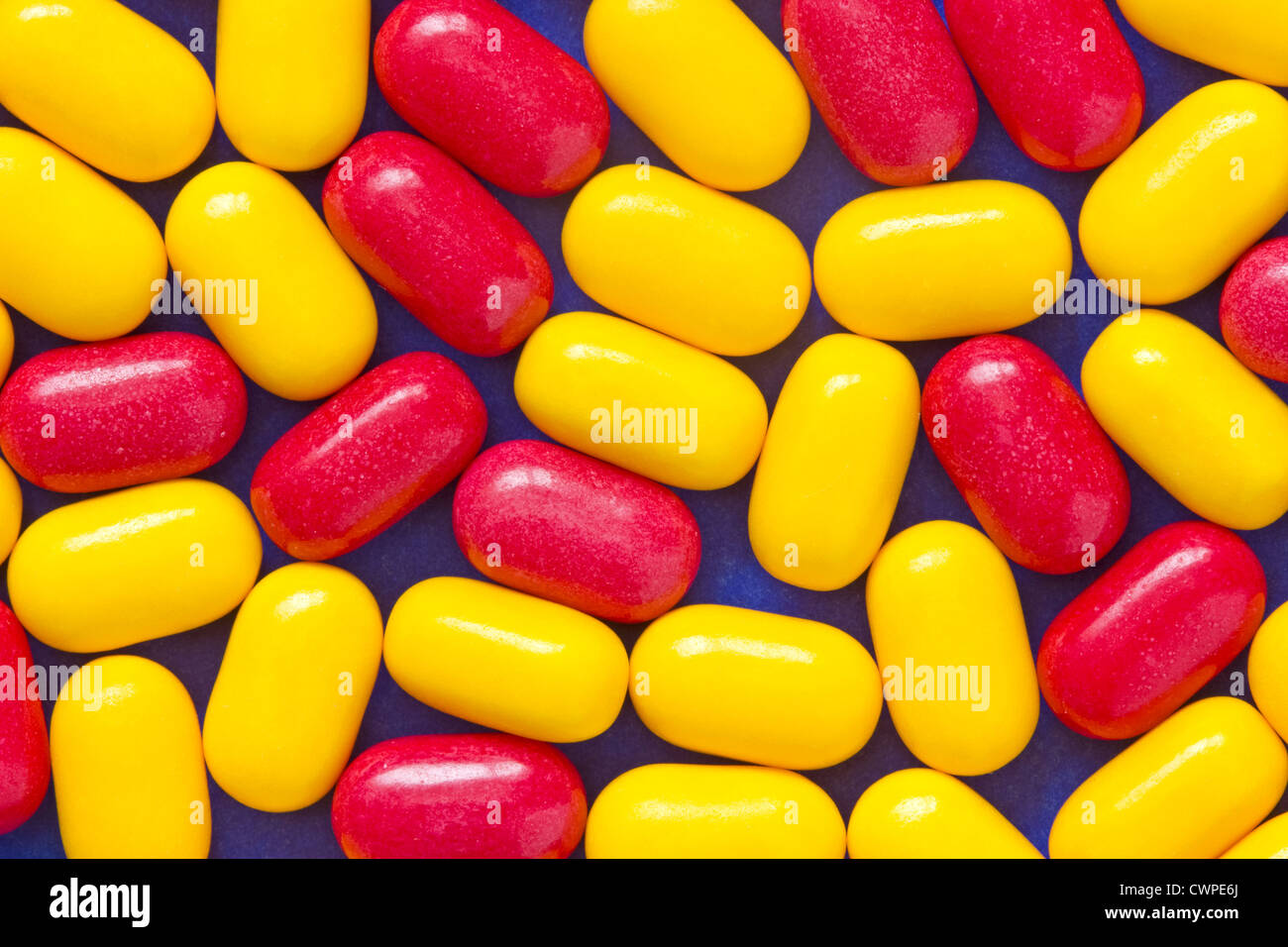 yellow and red candy mints breath freshener Stock Photo - Alamy