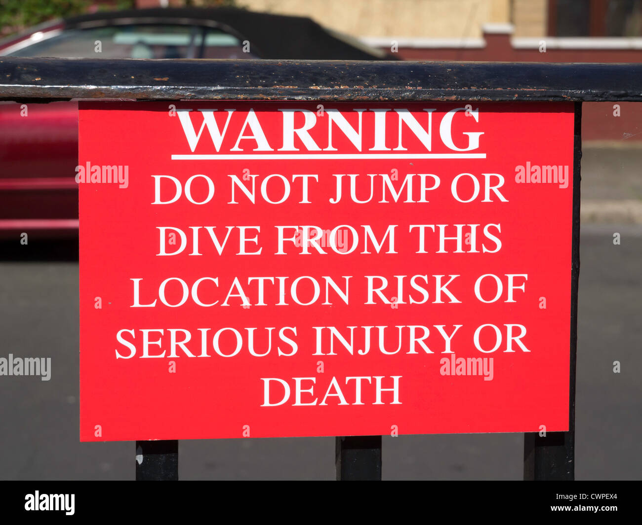 Warning sign do not jump or dive from this location risk of serious ...