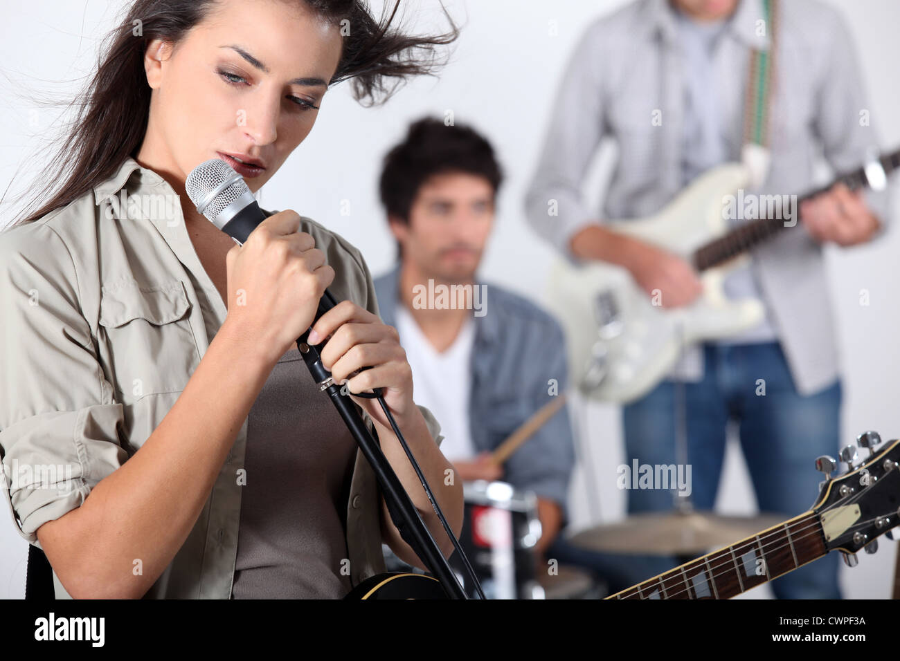 Woman playing in a band Stock Photo - Alamy