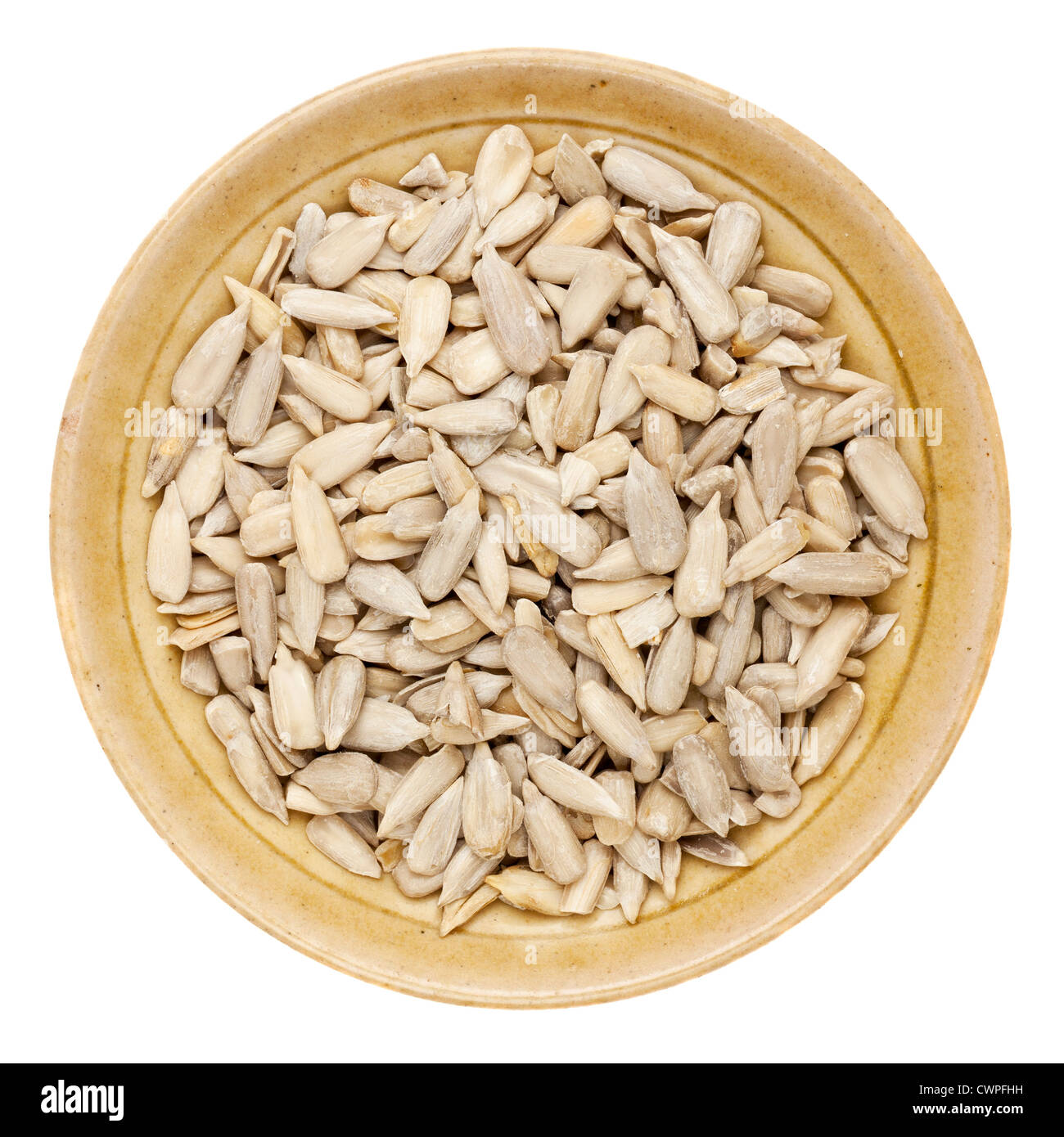 sunflower kernels in a round ceramic bowl isolated on white Stock Photo ...