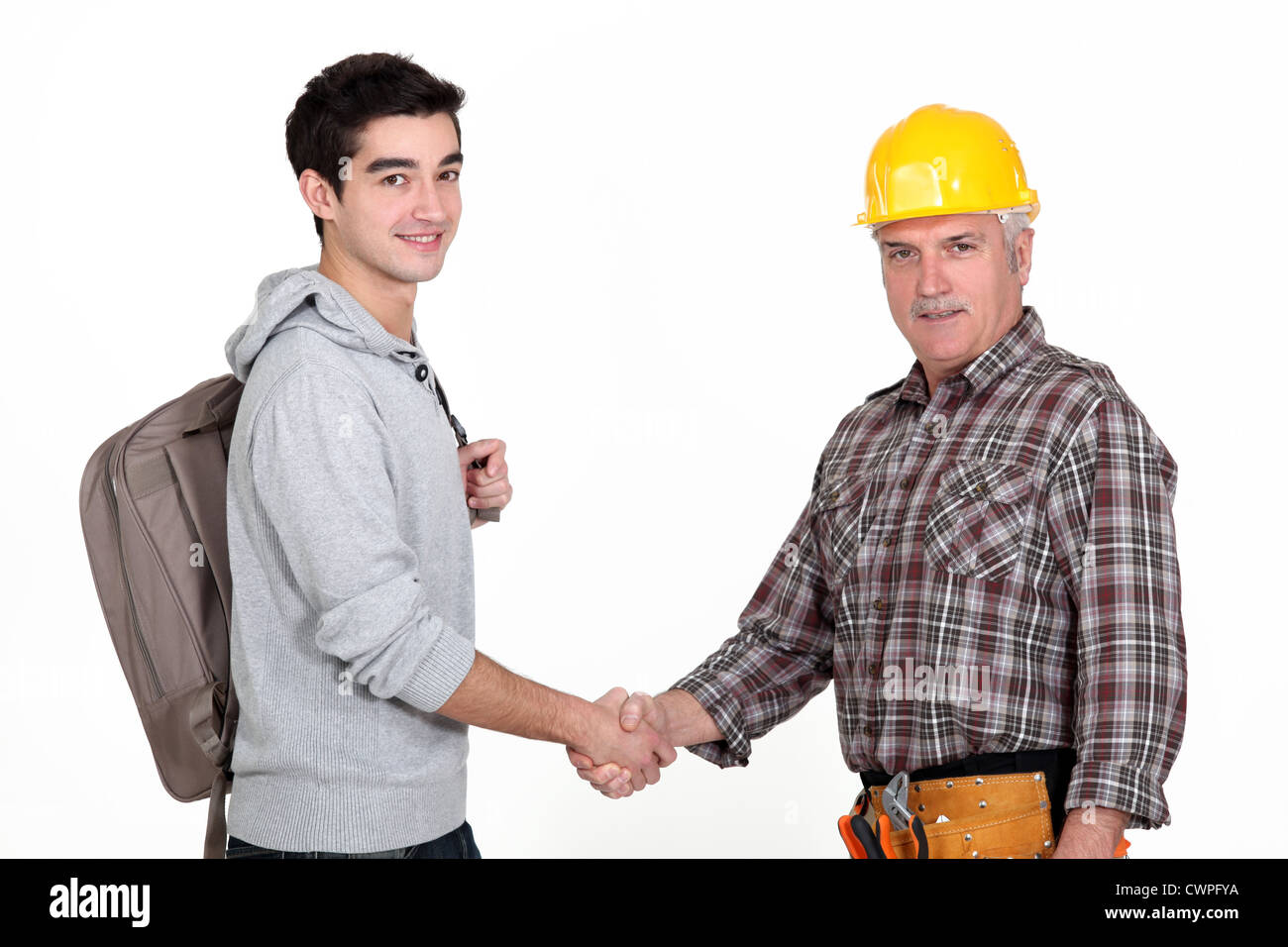 Construction worker shaking hands with a college student Stock Photo ...