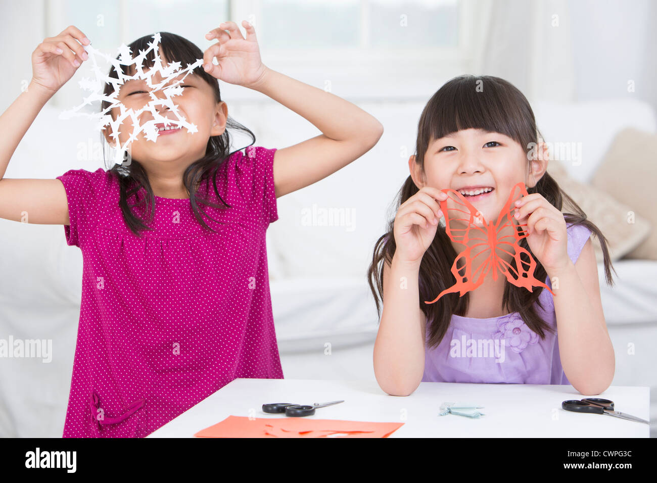 Girls making papercut Stock Photo - Alamy