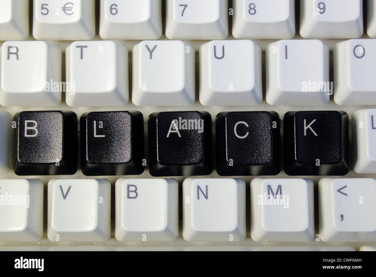 the word BLACK in black letters on a white keyboard Stock Photo - Alamy