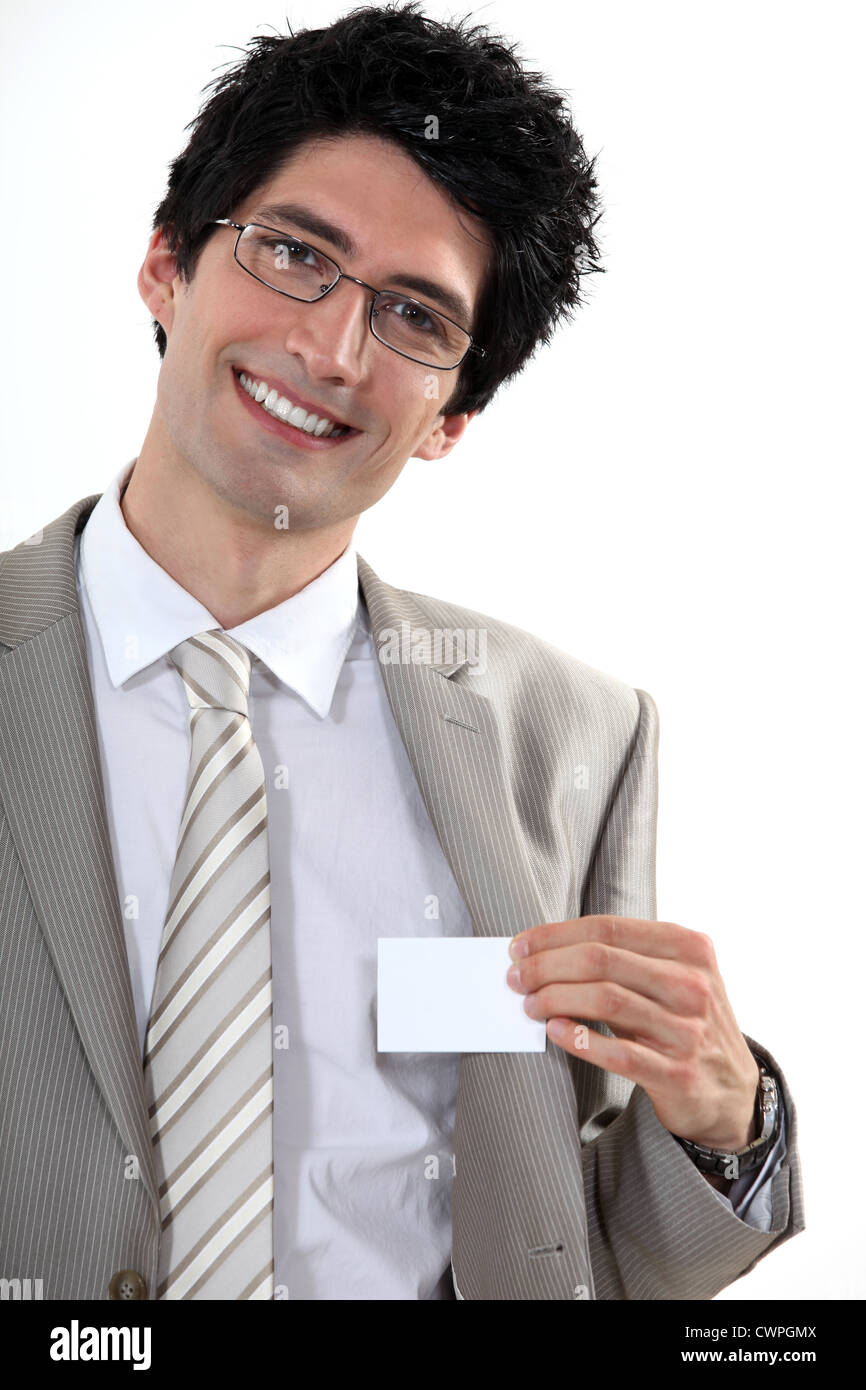 Businessman with glasses showing off business-card Stock Photo - Alamy