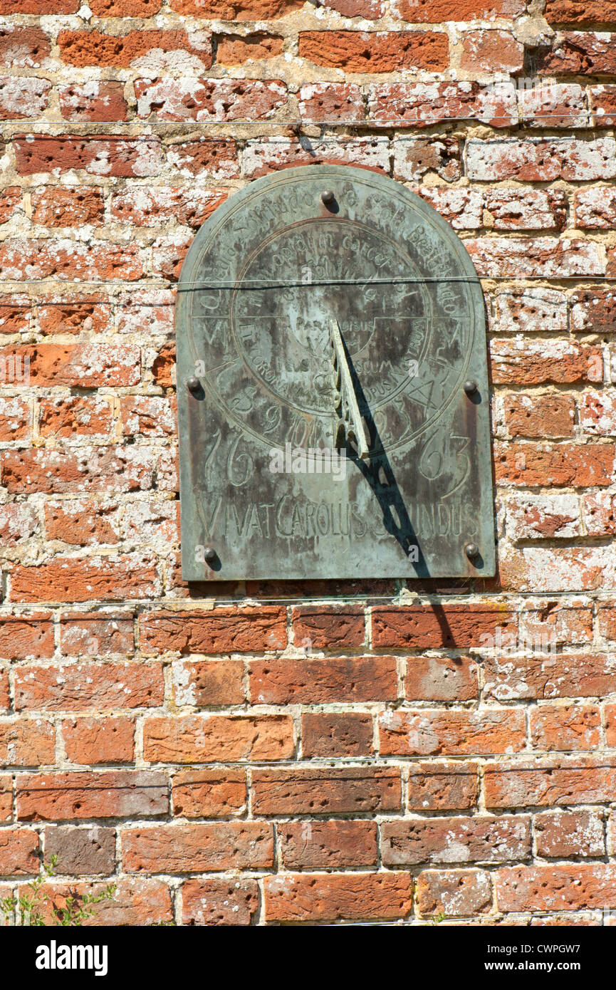 Vertical sundial on a garden wall, Surrey, UK Stock Photo - Alamy