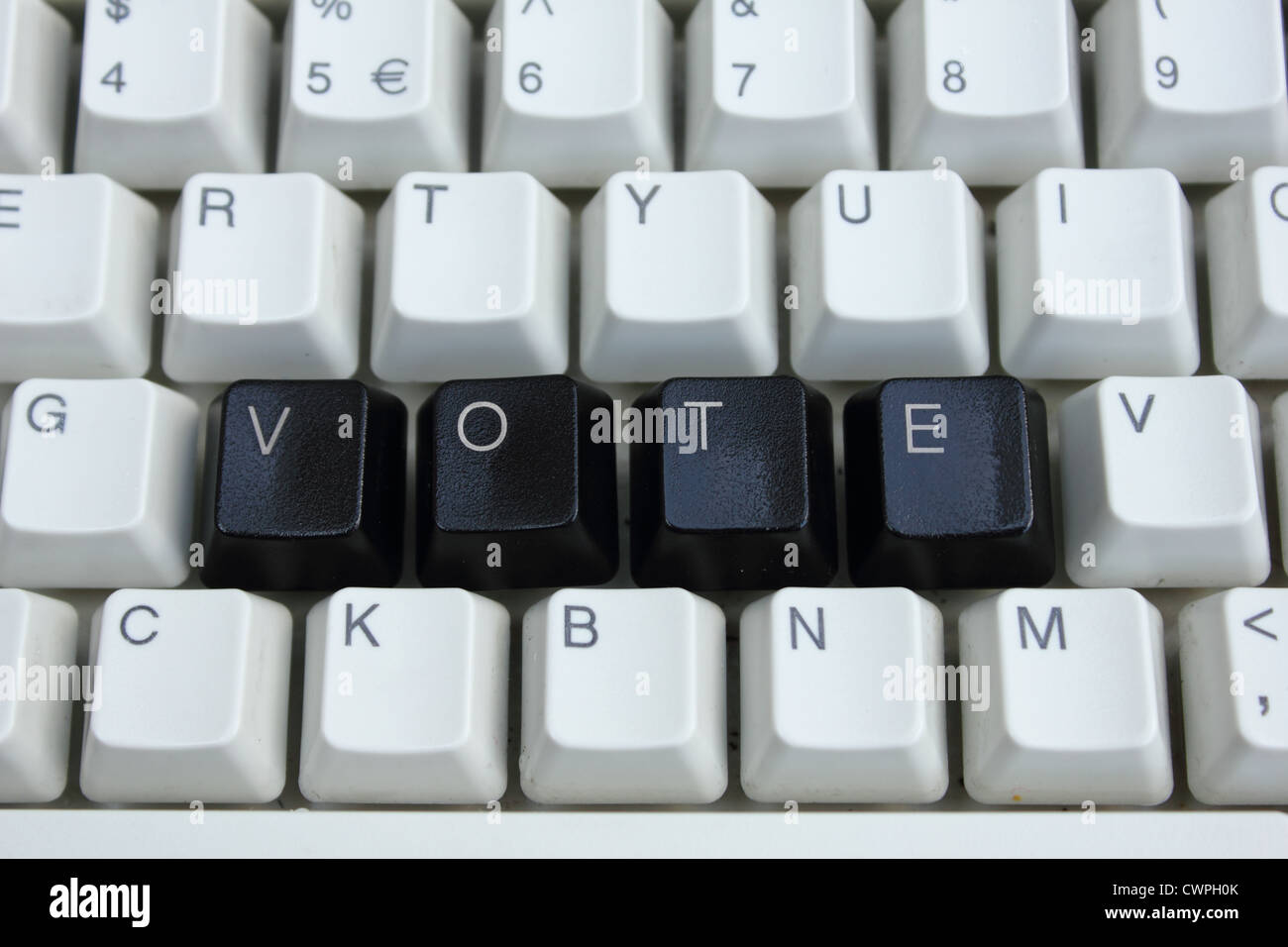 The word VOTE in black letters on a white keyboard Stock Photo - Alamy