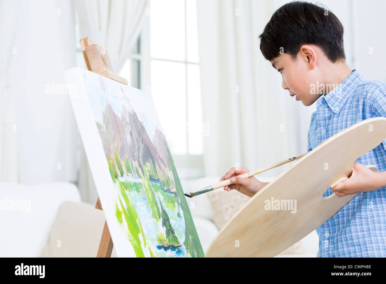 Little boy painting Stock Photo - Alamy