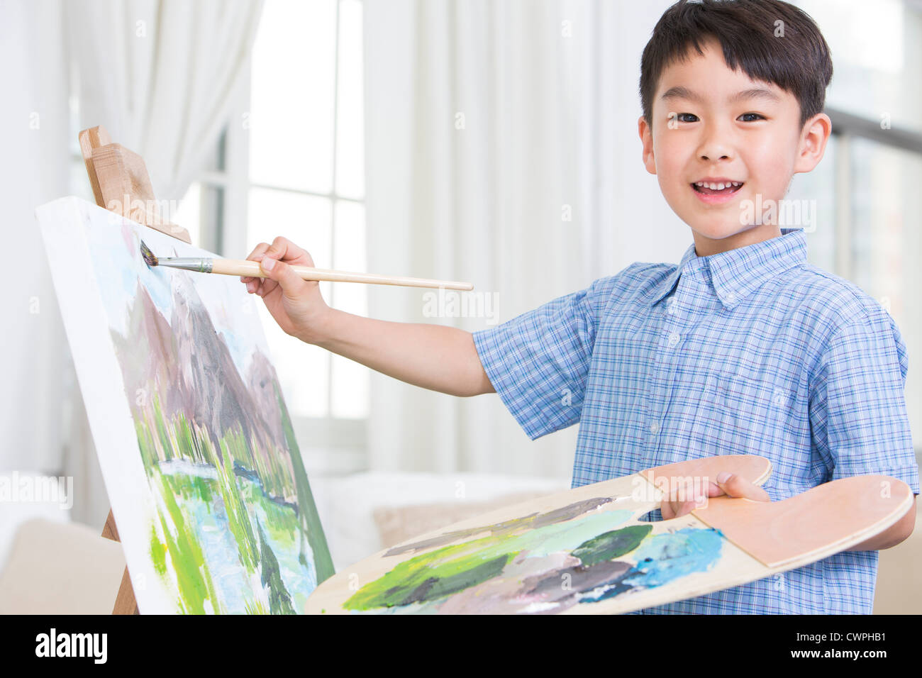 Little boy painting Stock Photo - Alamy
