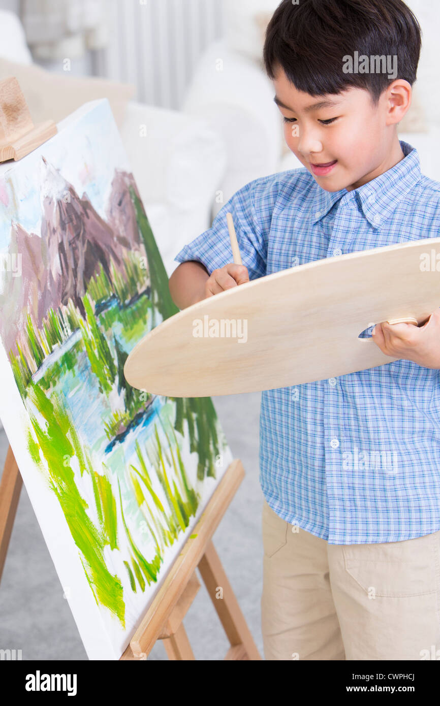 Little boy painting Stock Photo - Alamy