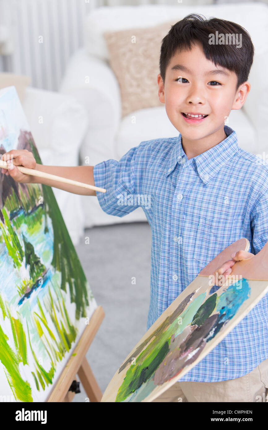 Little boy painting Stock Photo - Alamy