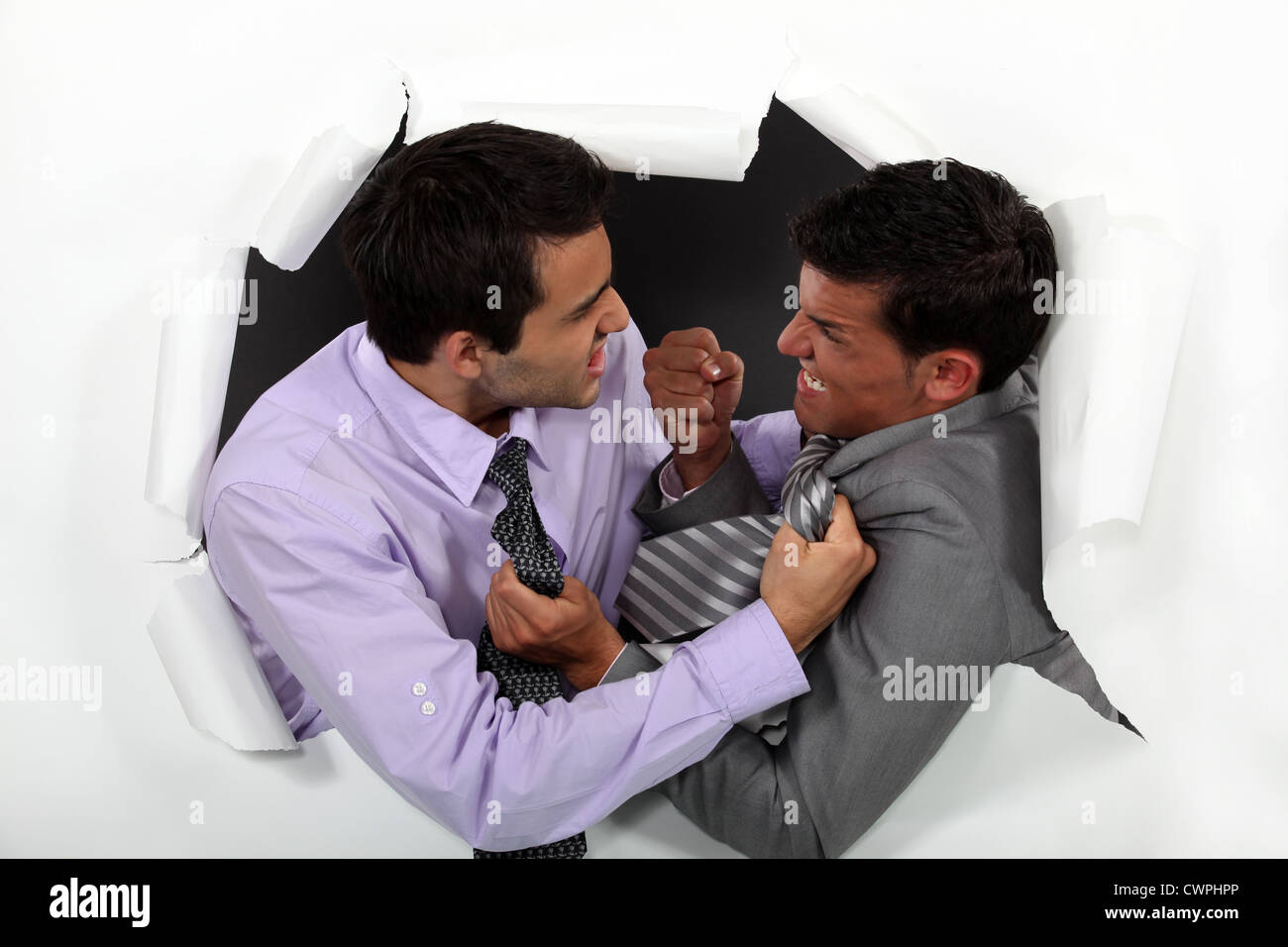 Two businessmen fighting Stock Photo - Alamy