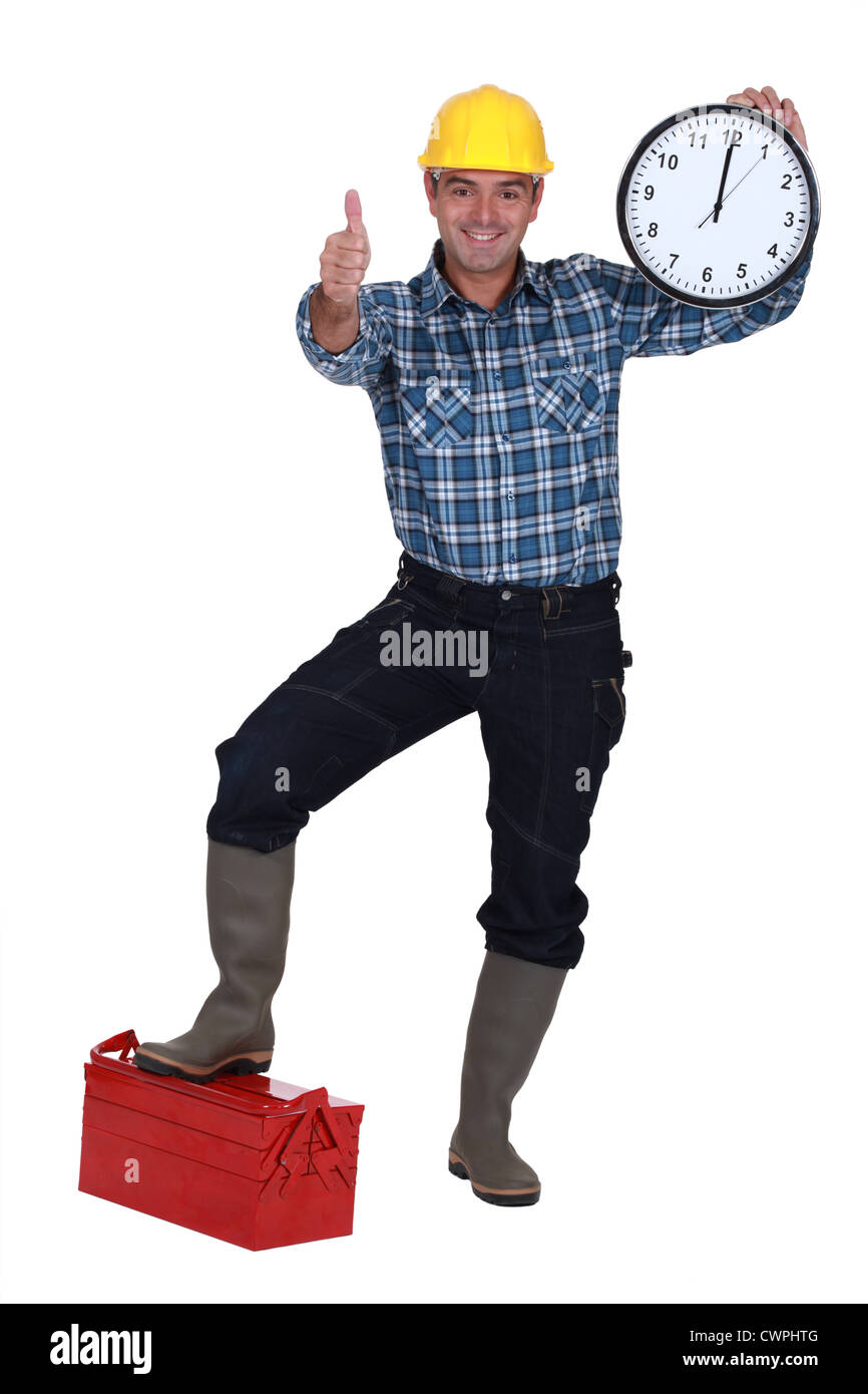 Thumbs up from a construction worker with a clock Stock Photo - Alamy