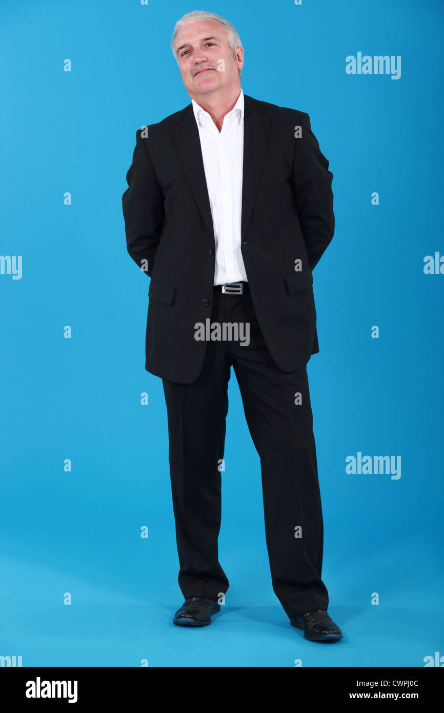 Confident grey-haired businessman Stock Photo - Alamy