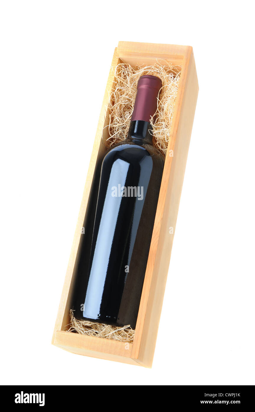 A single red wine bottle in wood box with straw packing over a white ...