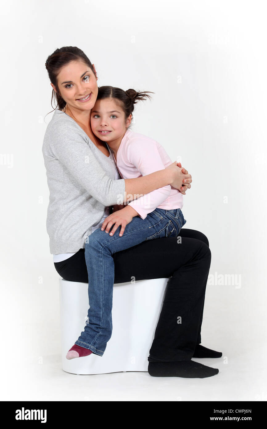 Woman hugging her child Stock Photo - Alamy