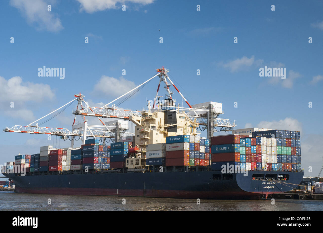 Cranes and gantries load and unload container ships in the Port of ...