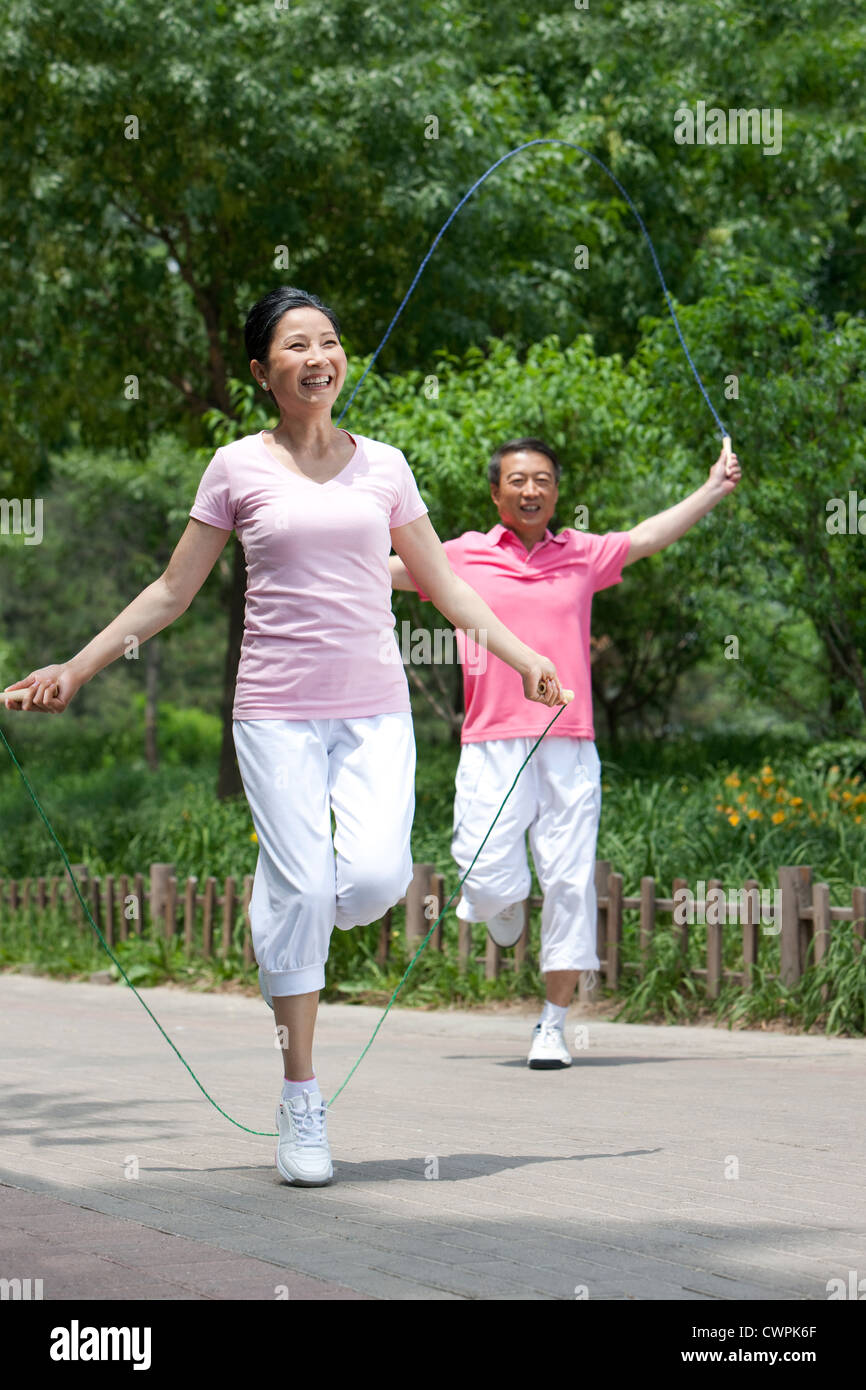 Two young women jumping rope hi-res stock photography and images - Alamy