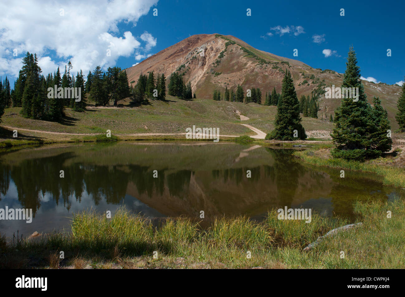 Cinnamon Mountain looms over an unnamed pond at Paradise Divide (11,300 ...
