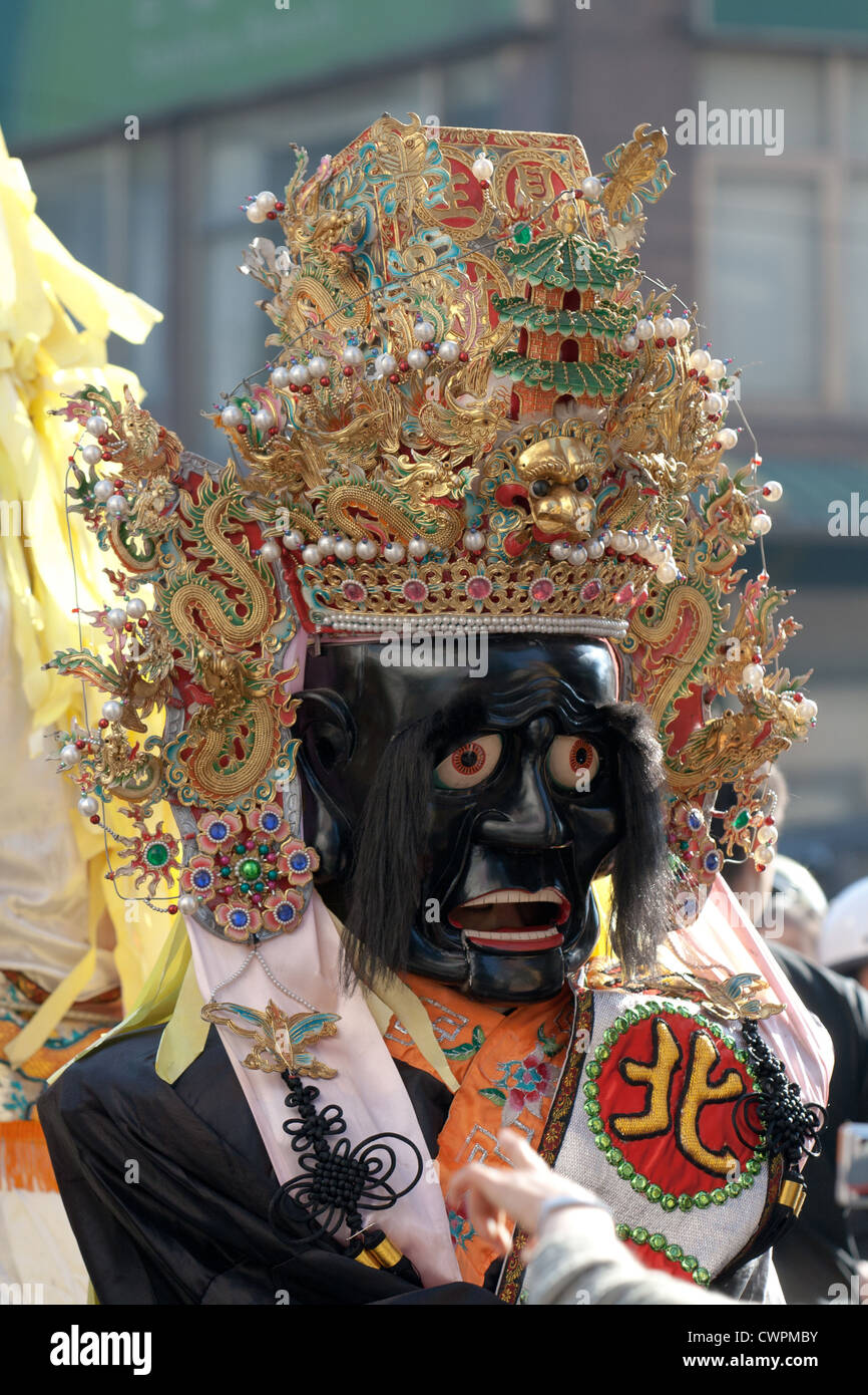 A mask of a taoist god at the "Pigs of God" festival around Chinese New ...